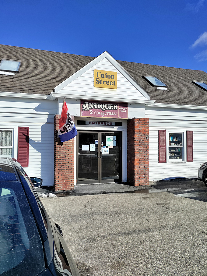 The unassuming exterior of Union Street Antiques beckons with its yellow sign and classic New England charm&mdash;a time portal disguised as a simple white building.