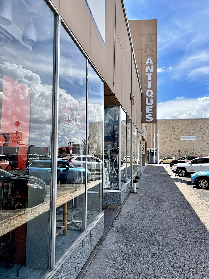 The storefront beckons with promises of treasures within, its blue lettering against beige like a desert sky invitation to explore.