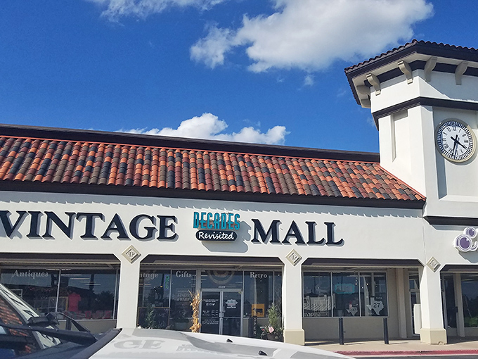 The Spanish-style facade with its signature clock tower offers zero hints about the time-traveling adventure waiting inside this unassuming Oklahoma strip mall. 