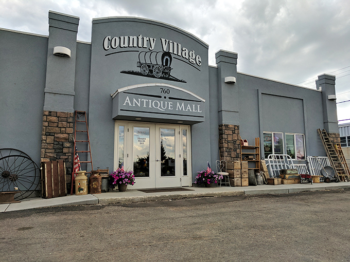 The unassuming exterior of Country Village Antique Mall belies the wonderland within, like a time-travel portal disguised as a suburban building.