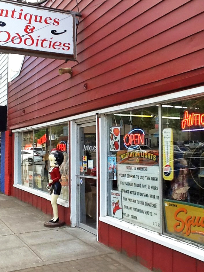 The wagon wheel above the storefront isn't just decoration&mdash;it's a time machine invitation to step back into a world where treasures await.