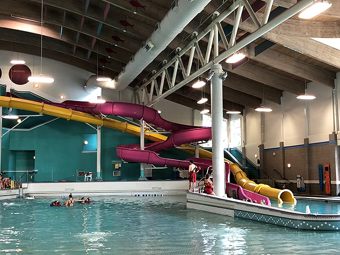 The aquatic playground of your dreams! Colorful slides twist and turn above the wave pool, promising adventures that'll make you forget you're indoors in Oregon.