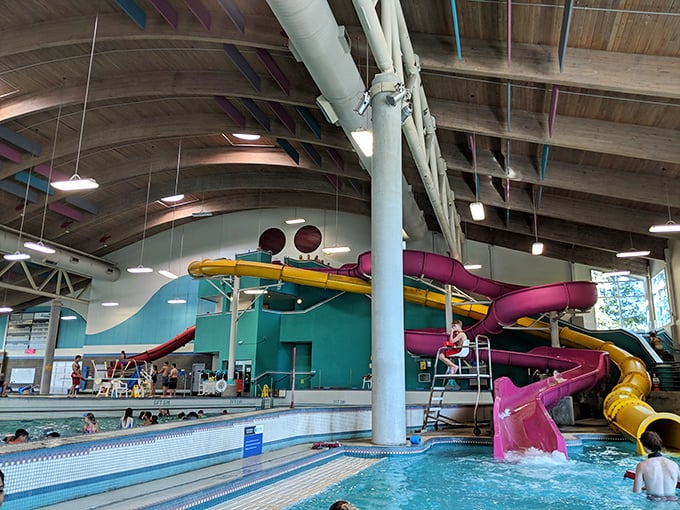The aquatic playground of your dreams! Colorful slides twist and turn above the wave pool, promising adventures that'll make you forget you're indoors in Oregon.