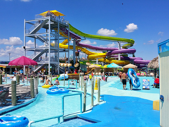 A rainbow of water slides cascades into crystal blue pools, promising the kind of summer day that makes winter worth enduring.