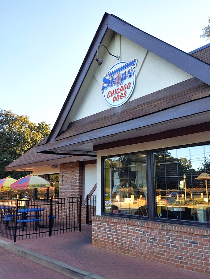 The Tudor-style exterior of Skip's Chicago Dogs stands as a welcoming beacon of Midwest flavor in the heart of Avondale Estates.