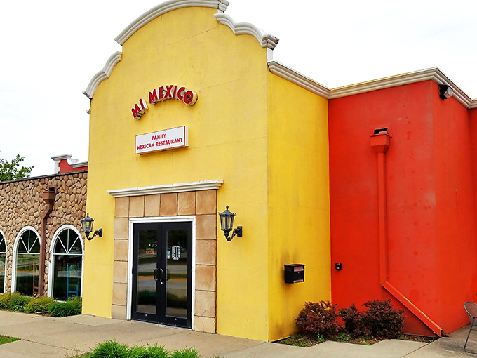 The sunshine-yellow exterior of Mi Mexico stands like a beacon of culinary promise in Clive, inviting hungry travelers to step inside and discover authentic flavors.