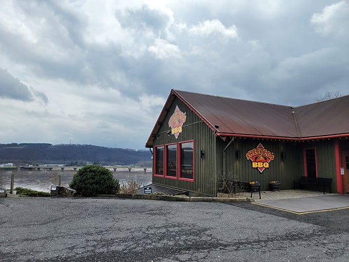 Skeeter's green exterior glows at dusk like a barbecue beacon, calling hungry travelers home with its rustic charm and promise of smoky delights.