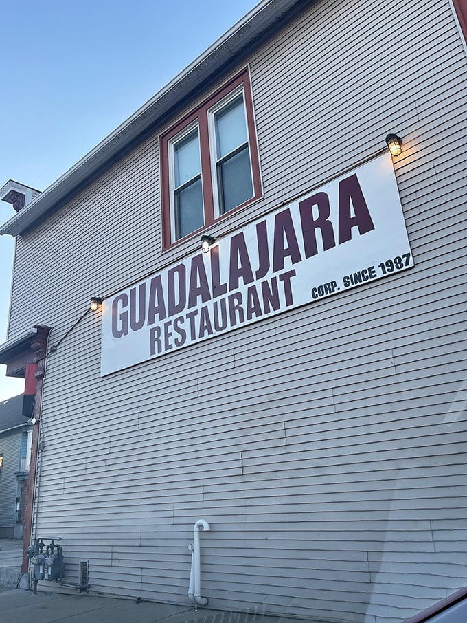 Guadalajara Restaurant's unassuming white exterior with bold red awnings stands like Milwaukee's best-kept culinary secret hiding in plain sight.