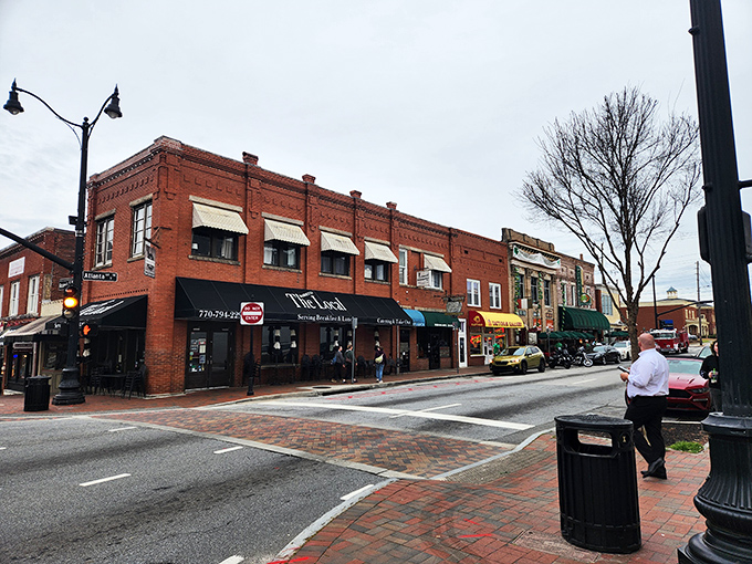 The historic red brick facade of The Marietta Local stands proudly on the corner, promising comfort and community with every meal served.