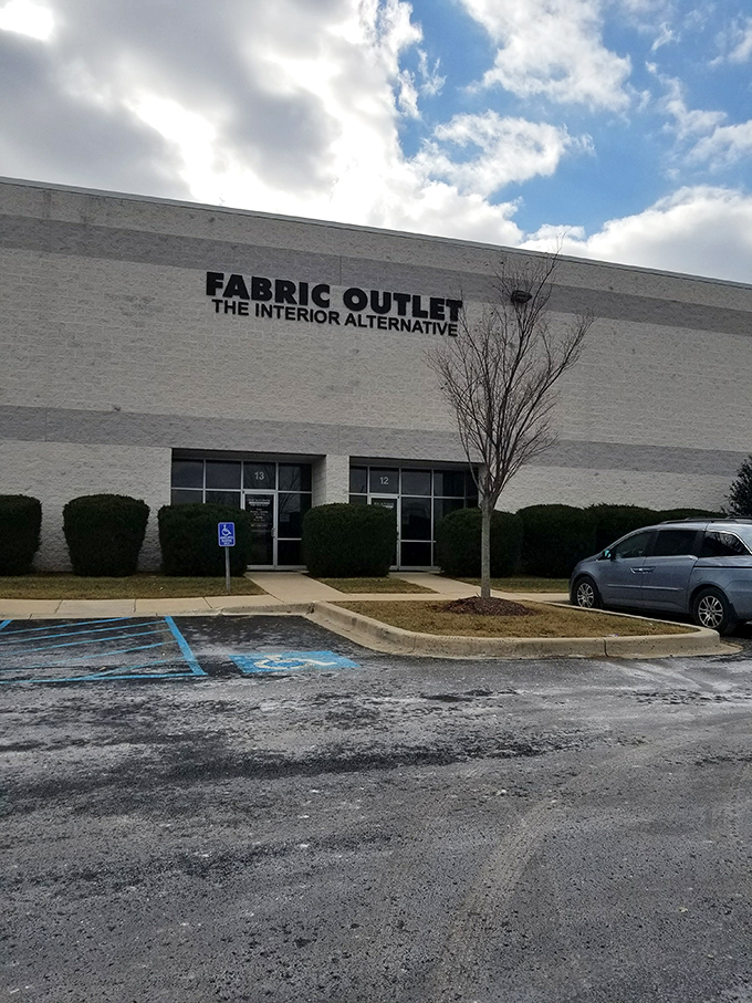 The unassuming exterior of fabric paradise – where textile dreams come true behind plain white walls. Who knew heaven had industrial siding?