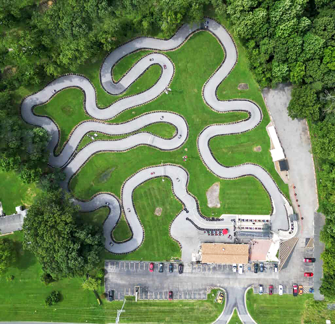 The sun-drenched track awaits its next speed demons, with tire barriers standing guard like patient sentinels against overzealous cornering attempts.