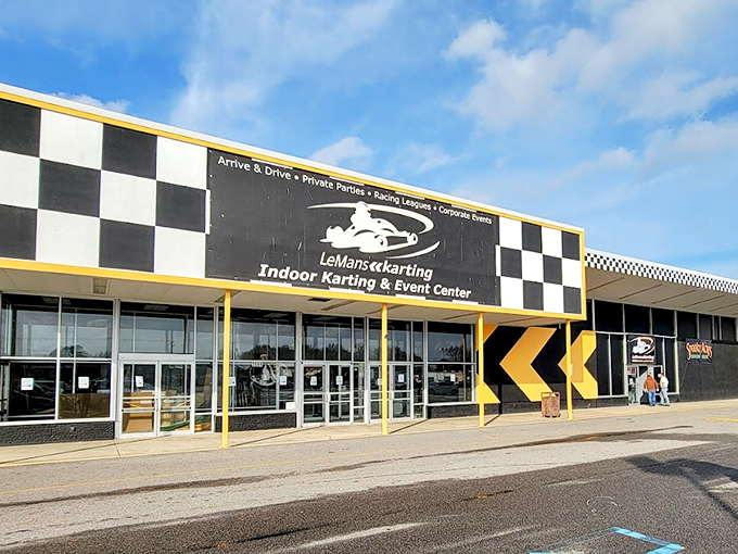 The sprawling indoor track beckons speed enthusiasts with its winding course and colorful barriers. Racing nirvana awaits under these fluorescent lights.