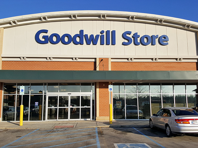 The Goodwill Store in Fishers stands like a fortress of forgotten treasures, its blue sign beckoning bargain hunters and nostalgia seekers alike.