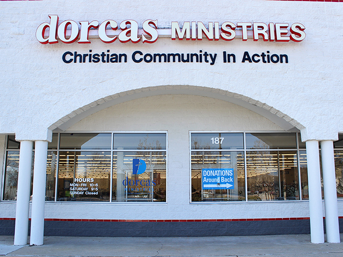 The welcoming fa&ccedil;ade of Dorcas Ministries invites treasure hunters with its clean white exterior and clear signage about donation procedures and store hours.