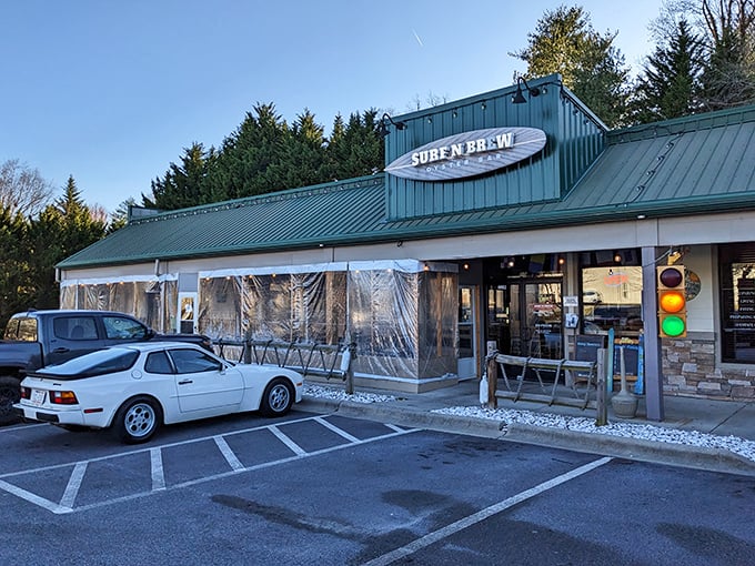 The surfboard sign announces your arrival at seafood paradise &ndash; where mountain air meets maritime flavor in Fletcher's unexpected coastal outpost.