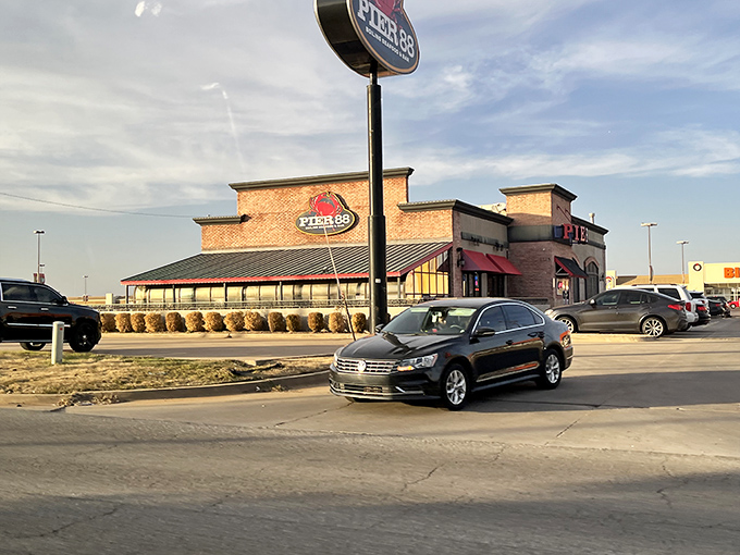 The bright red Pier 88 sign stands out like a lighthouse for seafood lovers, beckoning hungry Oklahomans to this coastal oasis in the heartland.