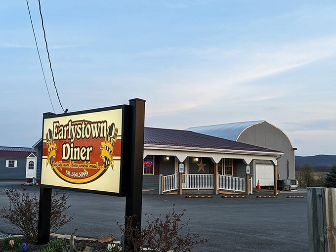 The unassuming exterior of Earlystown Diner belies the culinary treasures within. Those hanging purple petunias aren't just for show&mdash;they're your first clue that someone here cares about details.