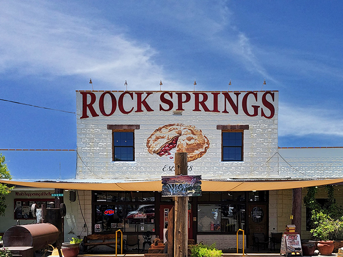 The iconic white facade of Rock Springs Caf&eacute; stands proudly against the Arizona sky, with that painted pie slice practically winking at hungry travelers on I-17.