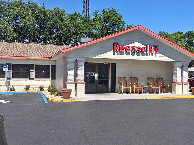 The welcoming facade of Reececliff, where those rocking chairs aren't just decoration—they're an invitation to slow down before the pie-induced euphoria begins.