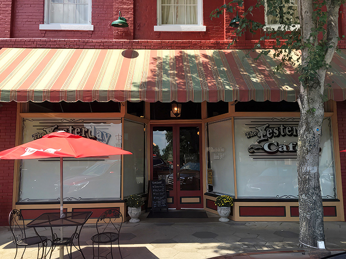 The red-trimmed entrance of The Yesterday Cafe beckons like an old friend, promising comfort food and conversations that linger longer than dessert.