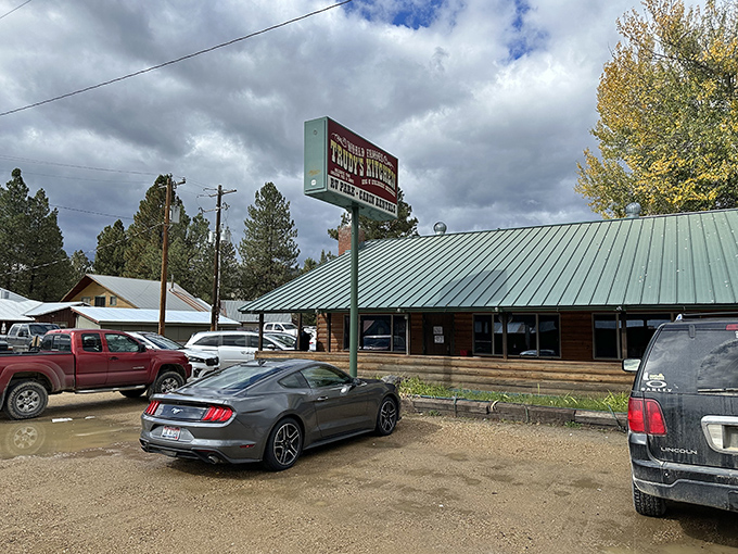 The log cabin exterior of Trudy's Kitchen stands like a delicious mirage in Idaho City, promising comfort food treasures within those timber walls.