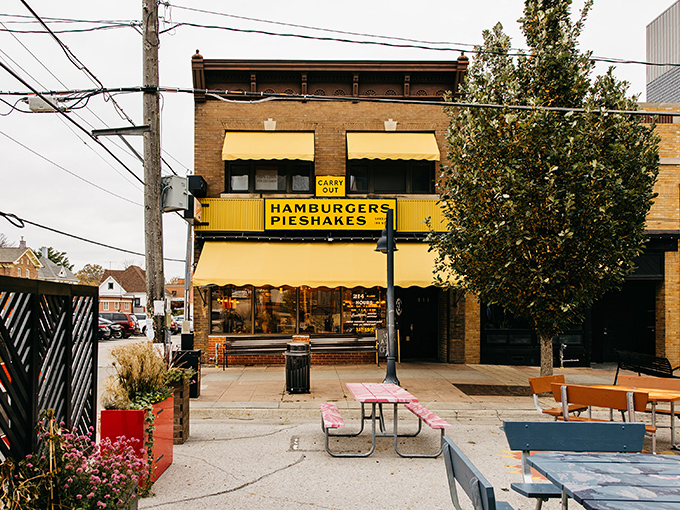 The iconic yellow awning of Hamburg Inn No. 2 beckons like a culinary lighthouse on Linn Street, promising comfort food that's stood the test of time since 1948.