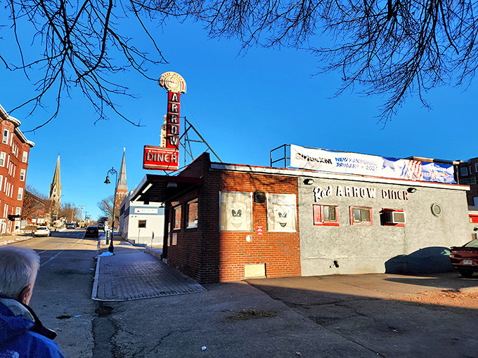 That iconic red arrow sign has been beckoning hungry travelers to this Manchester landmark since 1922, a neon North Star guiding food pilgrims home.