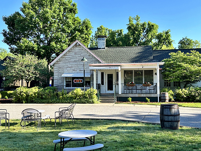 The white clapboard exterior of Loveless Cafe stands like a time capsule of Southern hospitality, complete with seasonal flower barrels and that iconic neon sign.