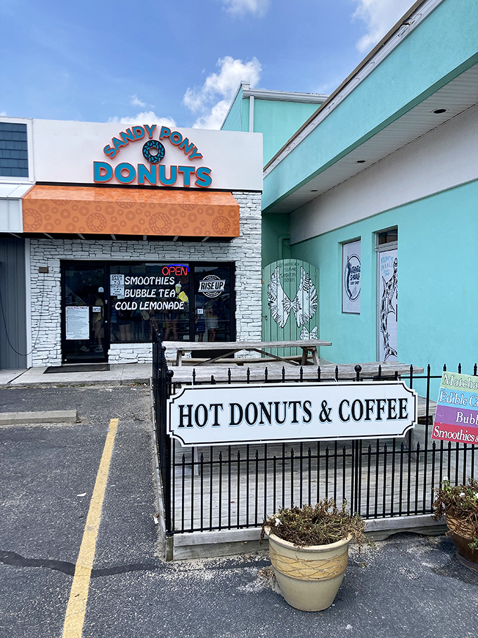 The turquoise beacon of breakfast bliss stands proudly on Bethany Beach's coastline, promising hot donuts that are worth every sandy footprint you'll track inside.