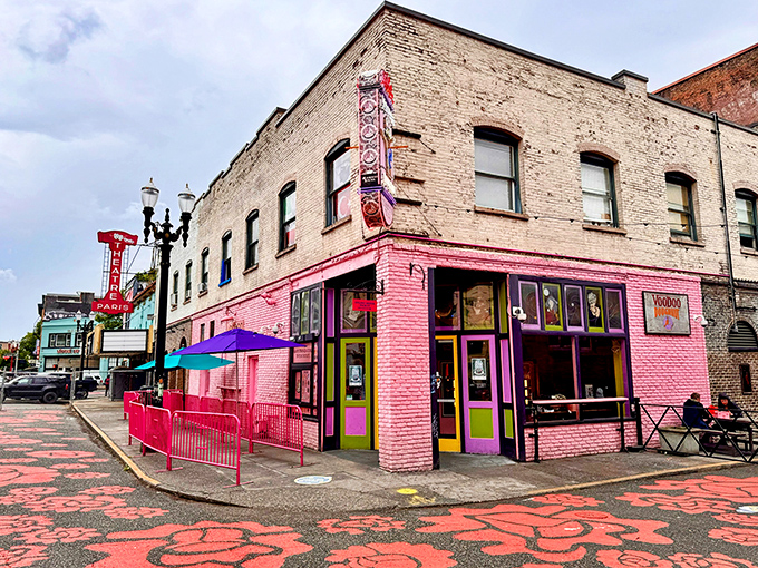 The corner where calories don't count. Voodoo Doughnut's iconic pink building stands like a sugar-powered beacon in downtown Portland, drawing pilgrims from across the globe.