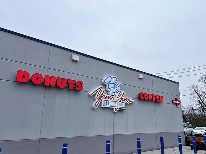The modest white exterior of Yum Yum Bake Shop belies the sweet treasures within. No architectural frills, just a singular focus on donut perfection. 