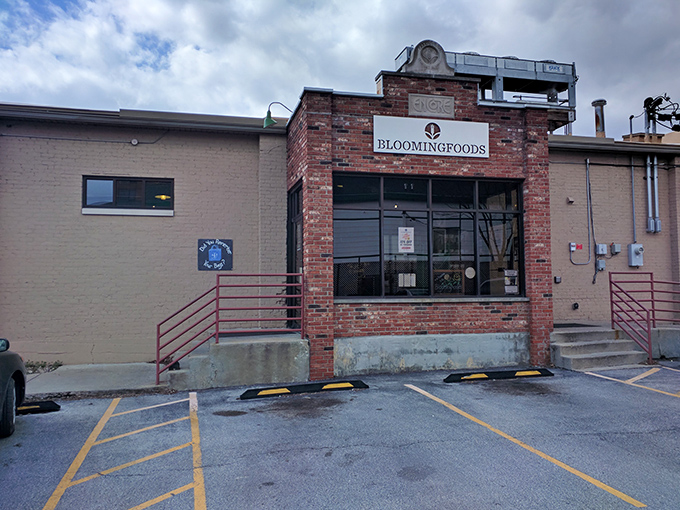 The unassuming brick exterior of Bloomingfoods East hides culinary treasures within, like a delicious secret waiting to be discovered by hungry passersby.