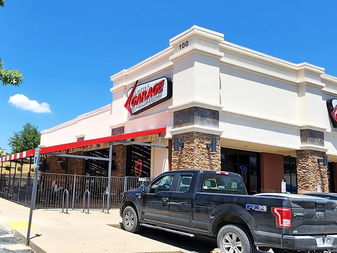 The neon-lit beacon of Smitty's Garage stands proud against the Arkansas sky, promising burger salvation to all who enter.