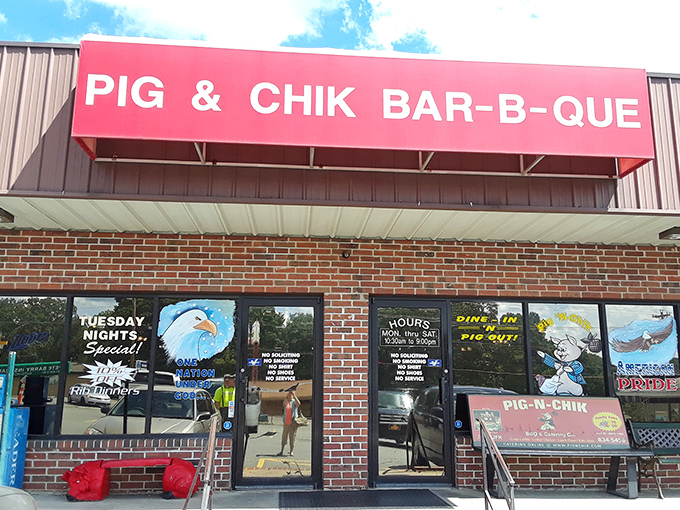 The bright red sign beckons like a barbecue lighthouse in a sea of hunger. No fancy frills here&mdash;just the promise of smoky delights waiting inside.