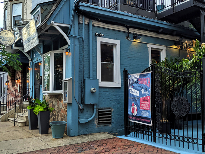 The blue facade of Trolley Square Oyster House beckons like a coastal lighthouse in urban Wilmington. Nautical charm meets historic neighborhood vibes.