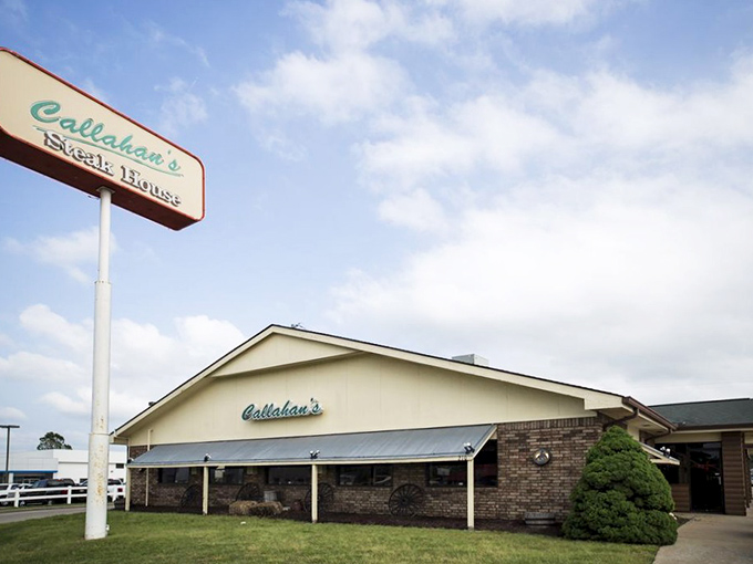 The unassuming exterior of Callahan's Steak House stands like a humble guardian of grilling secrets. No fancy frills, just the promise of carnivorous delight within.