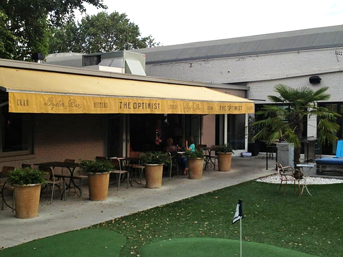 The outdoor oasis at The Optimist proves that sometimes the best appetizer is fresh air and a mini-golf challenge before diving into seafood heaven. 