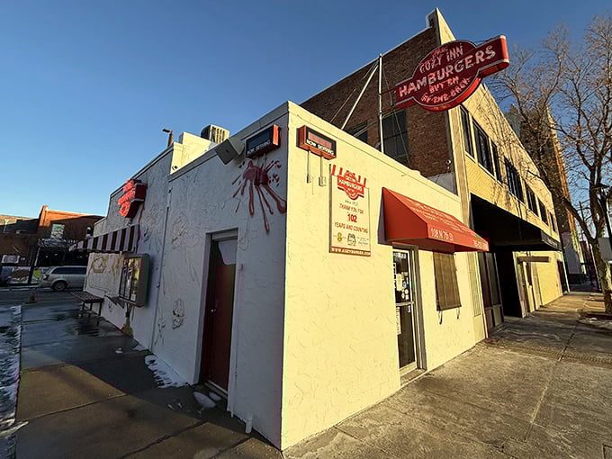 The unassuming white exterior of Cozy Inn belies its legendary status. Like finding a Picasso at a yard sale, this humble building houses burger greatness.