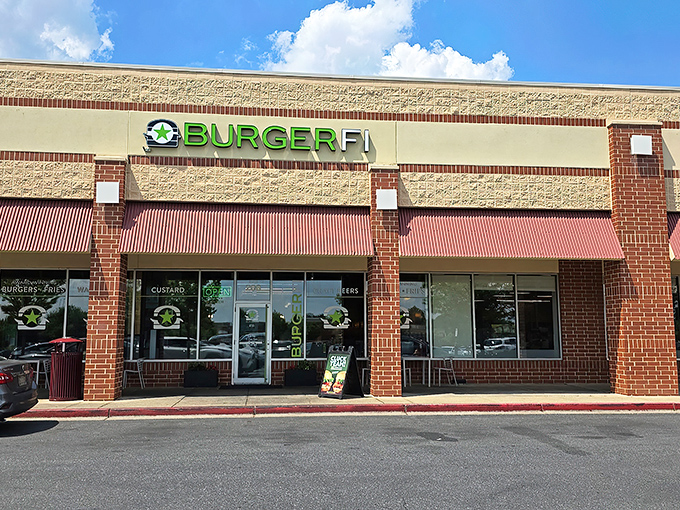 BurgerFi's Columbia storefront stands ready to welcome hungry Marylanders with its distinctive green signage and brick facade—burger paradise awaits behind those doors.