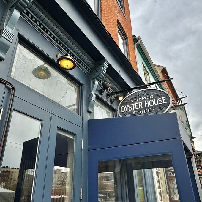 The unassuming blue storefront of Thames Street Oyster House stands like a culinary lighthouse in Fells Point, beckoning seafood lovers from miles around. 