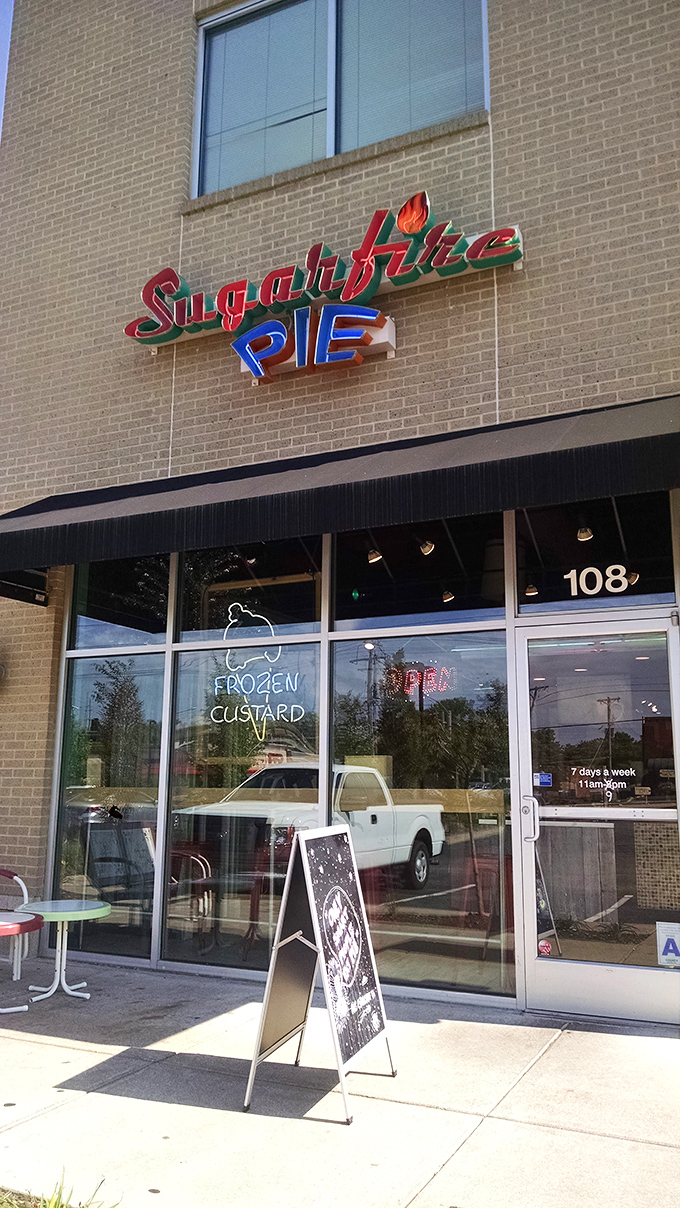 The colorful Sugarfire Pie sign promises "Custard Local Confections" &ndash; a beacon of sweetness in Olivette that delivers on every sugary syllable.