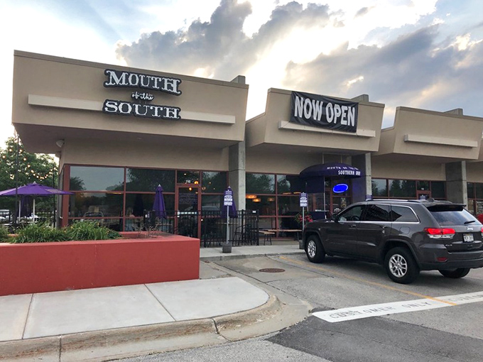 Those vibrant purple umbrellas are like beacons of flavor, signaling that this unassuming Omaha storefront houses serious Southern magic.