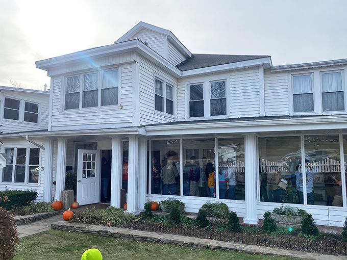 The charming white clapboard exterior of Dan'l Boone Inn welcomes visitors with a picket fence straight out of an American storybook.