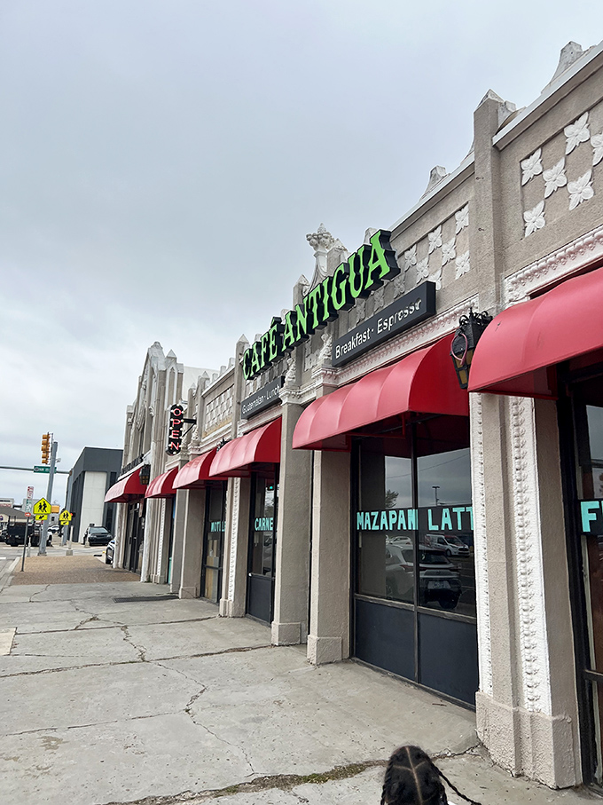 The bright green lettering of Cafe Antigua stands out against Oklahoma's sky like a beacon calling all hungry travelers home.