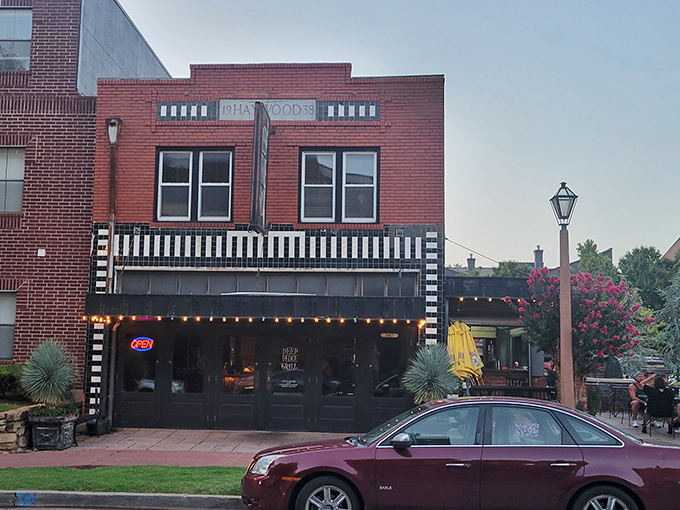 The brick-lined entrance to Deep Deuce Grill beckons like an old friend, promising good times and even better food in this historic Oklahoma City district.