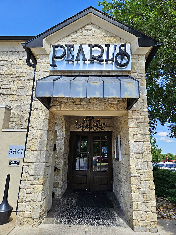 Pearl's striking stone exterior stands like a coastal mirage in Oklahoma City, complete with a rooftop patio that begs for sunset cocktails and seafood feasts.