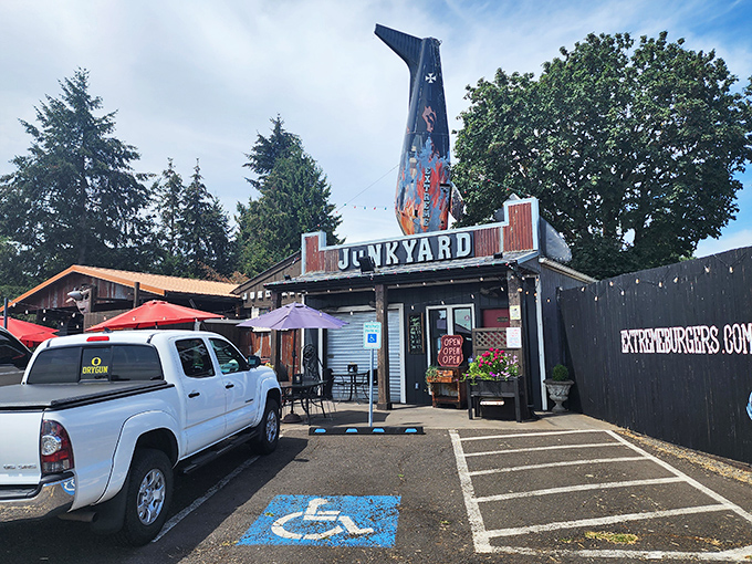 The ultimate roadside treasure hunt ends here! Junkyard's exterior promises automotive nostalgia and burger bliss under Oregon skies. 