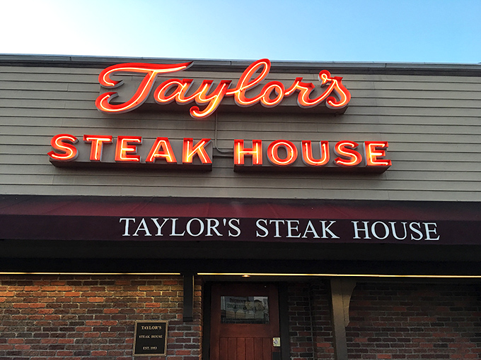 The unassuming brick facade of Taylor's Steak House stands like a culinary speakeasy, promising carnivorous delights behind its modest exterior.