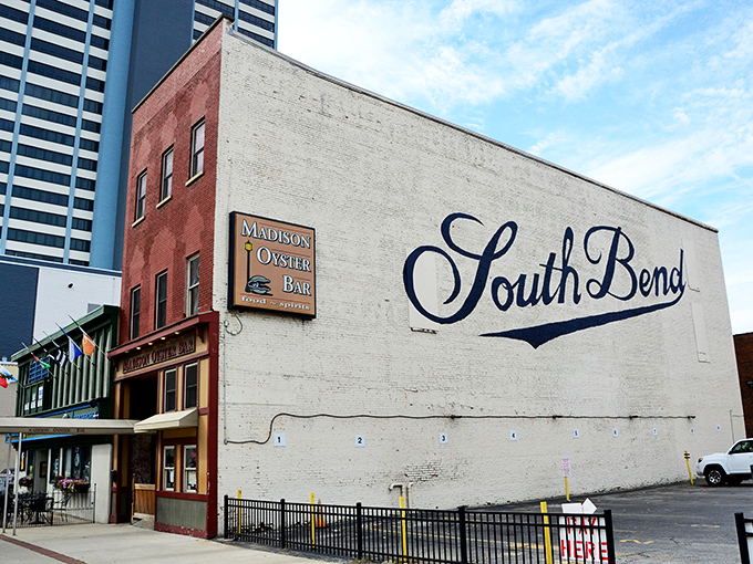 The Madison Oyster Bar stands proudly against South Bend's skyline, a brick beacon of seafood salvation in the heart of Notre Dame country.