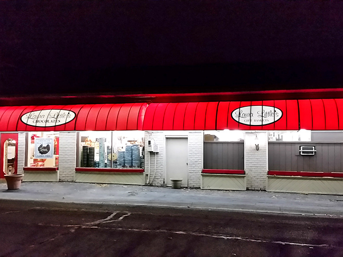 The iconic red awning of Laura Little's Candy Kitchen beckons like a sweet siren call, promising sugary treasures within this Prairie Village landmark.